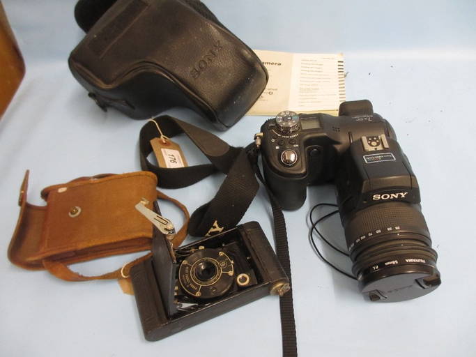 Sony Cybershot Digital Camera And A Folding Camera