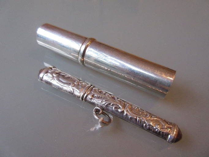 Silver Needle Case And A Silver Atomiser