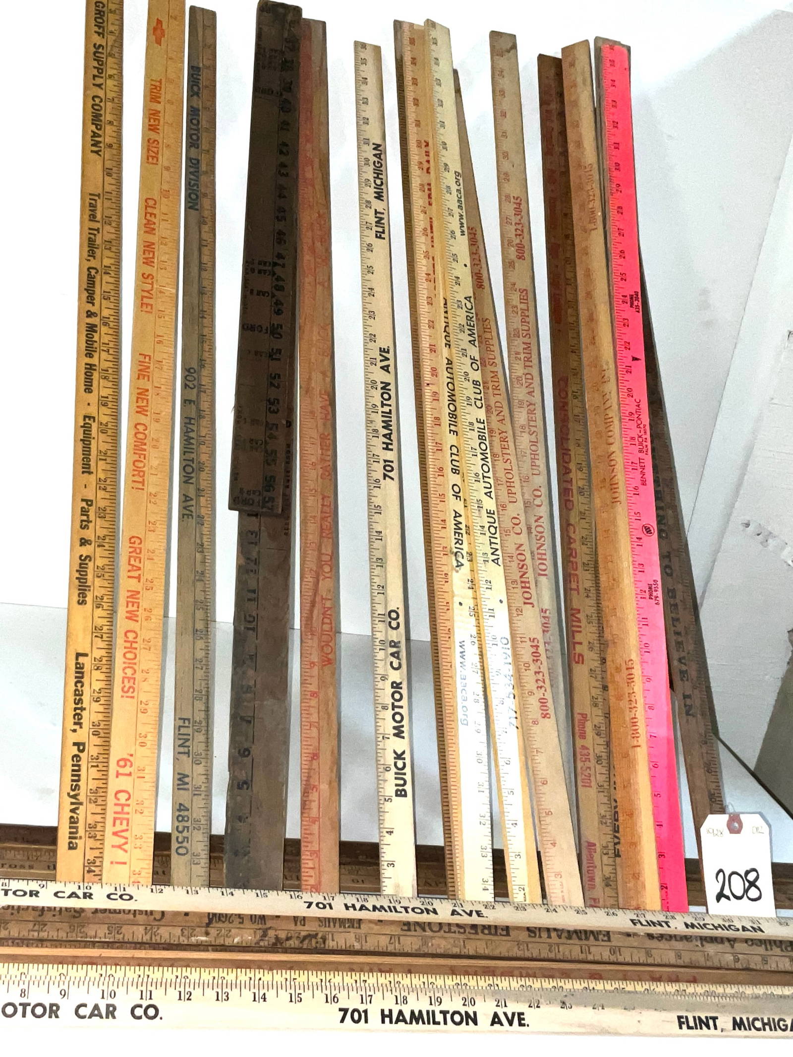 Assorted Advertising Wooden Yard Sticks. Auction