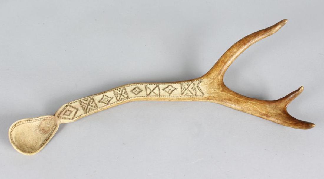AN INUIT CARVED, REINDEER ANTLER SPOON, 19TH CENTURY,