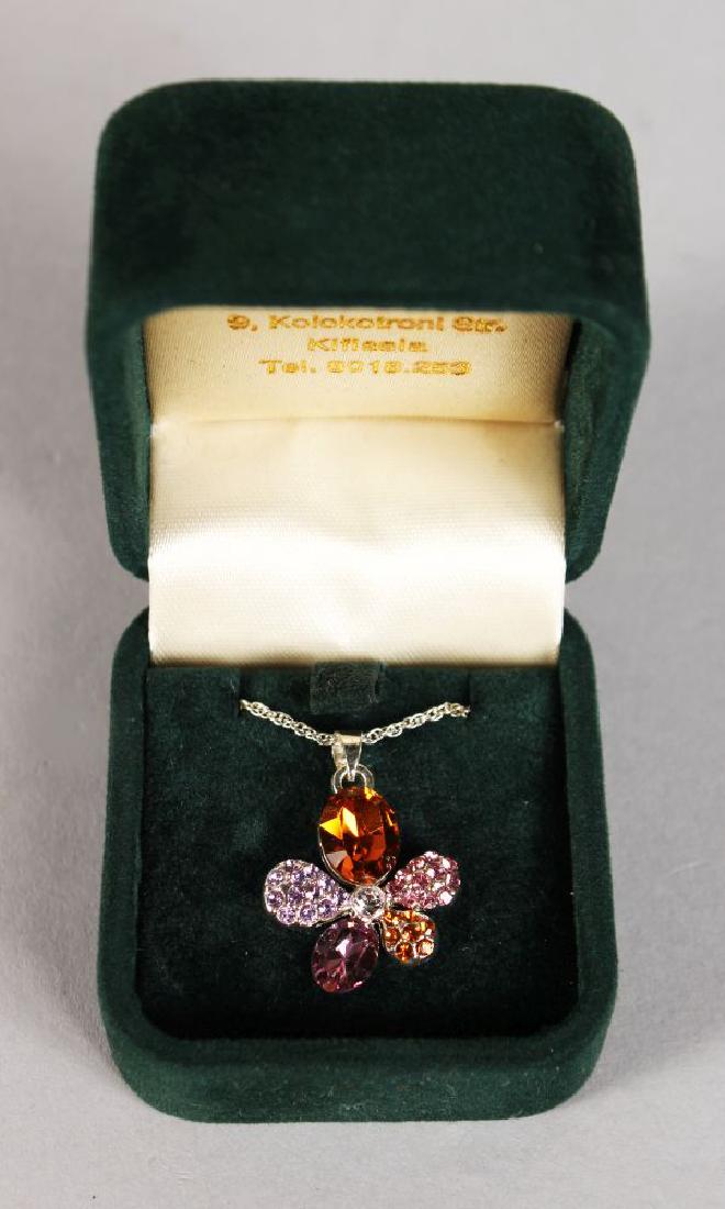 A PENDANT AND CHAIN. Signed LDADPR.