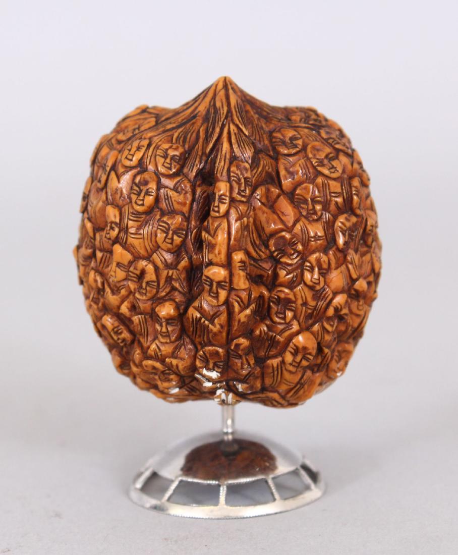 A 19TH/20TH CENTURY CHINESE CARVED WALNUT SHELL,