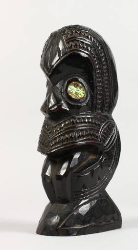 A Maori Carved Wood Head With Mother Of Pearl Eyes.