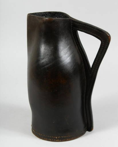 A Good Early Leather Bombard. 12ins High.