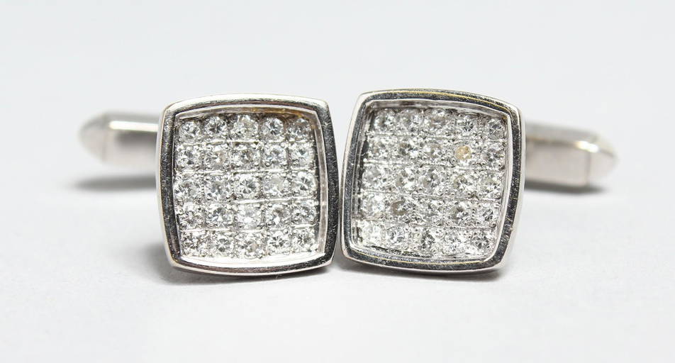 A Pair Of 18ct White Gold And Pave Set Diamond Cuff Links.