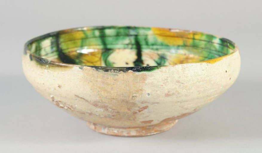 A 10th 11th Century Persian Splash Ware Pottery Bowl, 19cm Diameter.