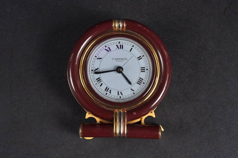 A Cartier Red And Gilt Circular Easel Clock. 3.75ins