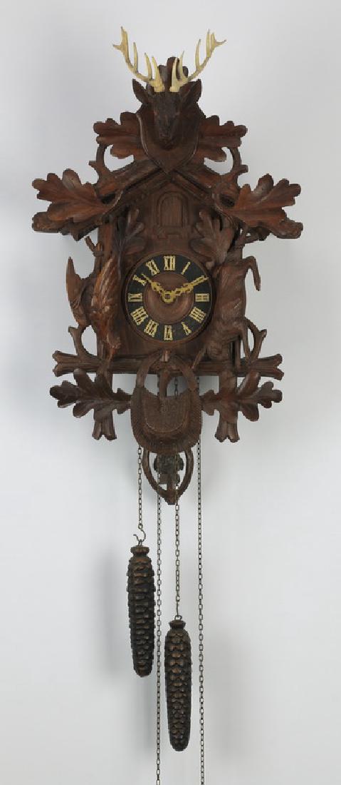 Carved Black Forest hunter's cuckoo clock