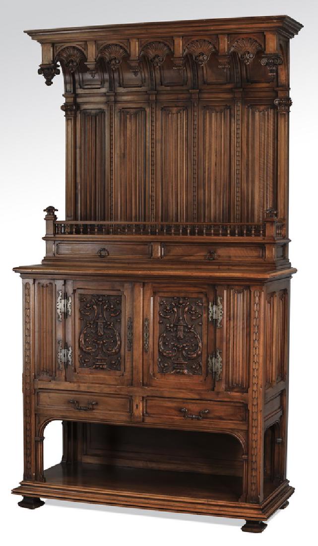 Highly carved French walnut canopy buffet, 19th c.