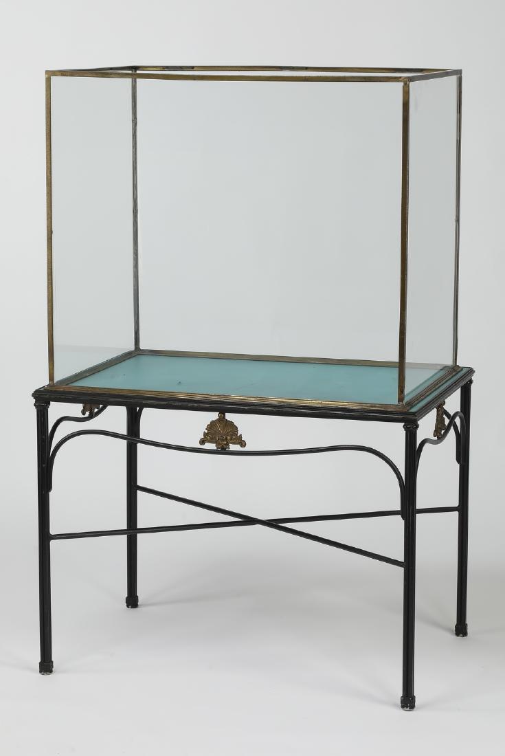 Glass display case on a wrought iron stand, 54"h