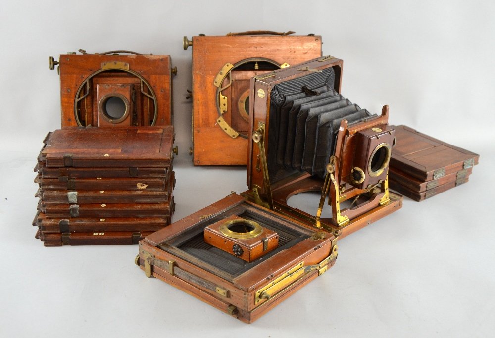 Four mahogany plate cameras, one marked The Sandringham