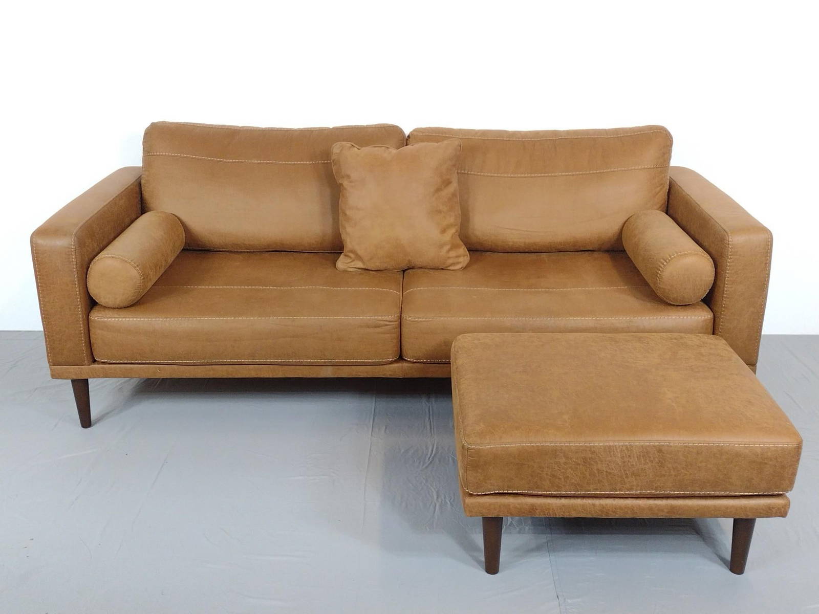 Ashley Furniture Faux Leather Telora Sofa & Ottoman Auction