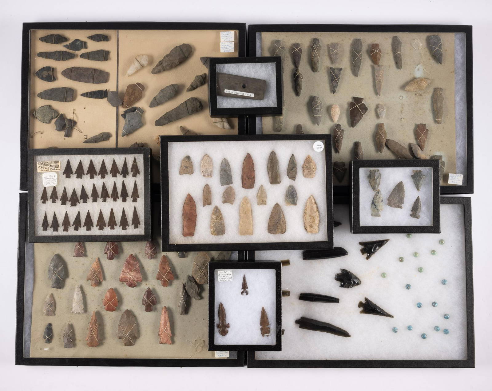 Nine Riker Mounts Containing Arrowheads, Beads And Lithic Items Auction