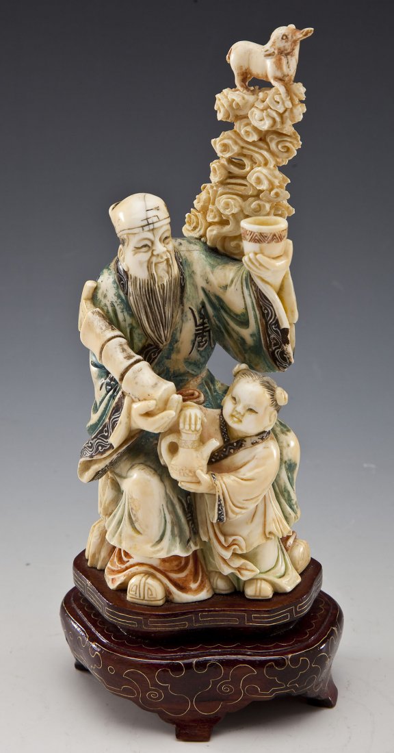 Carved & Polychrome Ivory Man & Child under Clouds
