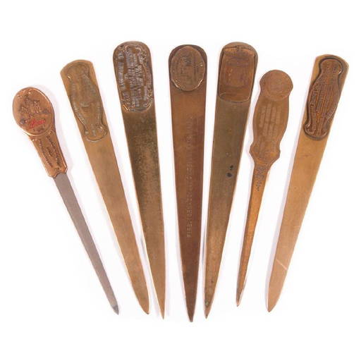 Seven Metal Letter Openers With Advertising Mounts.