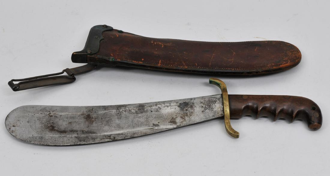 Bolo knife with brown leather sheath WWI era. Stamped