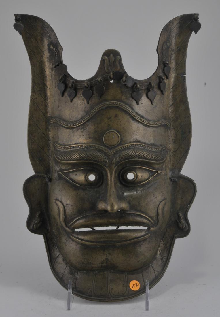 Temple mask. India. 19th century. Bronze. Demon form.