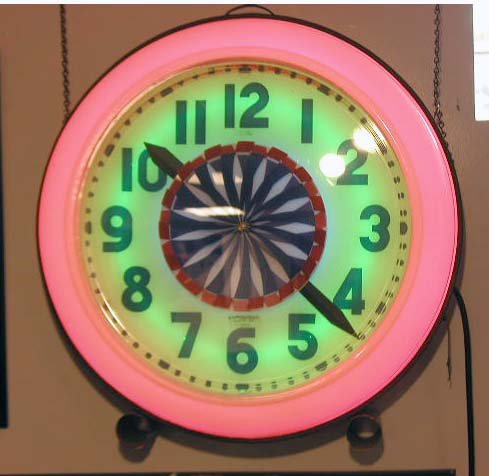 1180: 1940's neon spinner wall clock