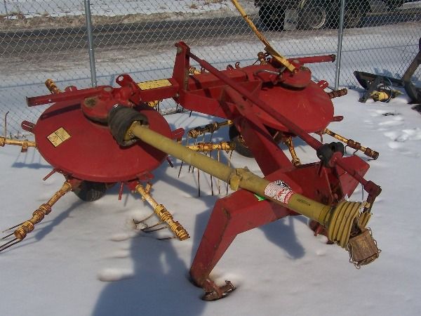 49: New Holland 254 Tedder Rake for tractor.