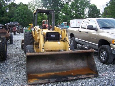 1302: Ford 545C 4x4 Tractor with Loader, Box Blade