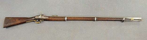451: 1860 Enfield rifle with brass trigger guard. Foun