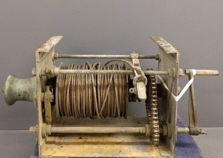 Windlass Winch With Cable And Crank On Side.