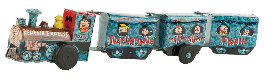 A Bedrock Express Wind Up Tin Train Toy.