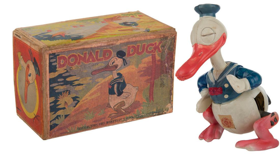 A "donald Duck Waddler" Celluloid Wind Up With Box.