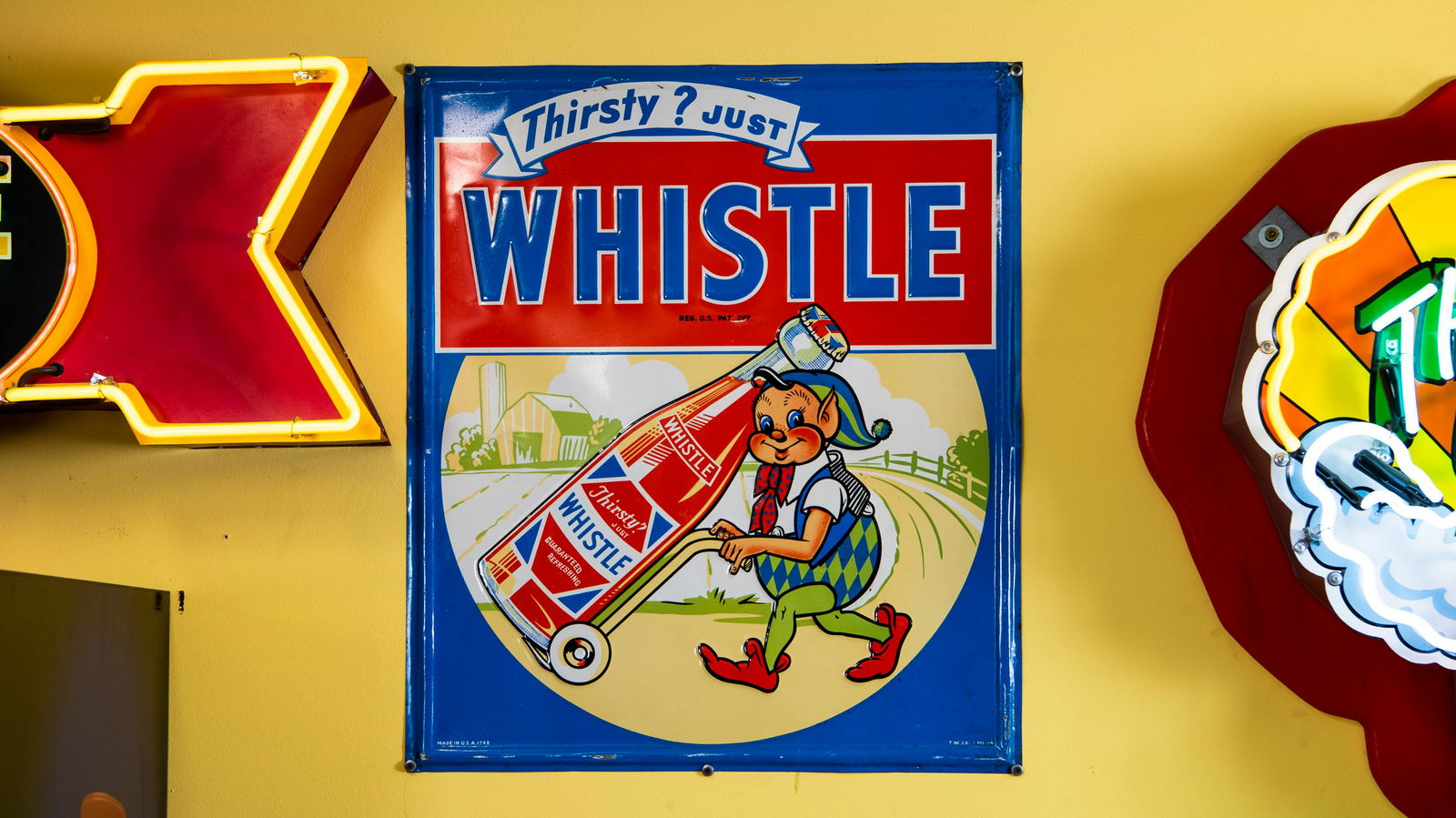 1948 Whistle Orange Soda Single Sided Embossed Tin Sign