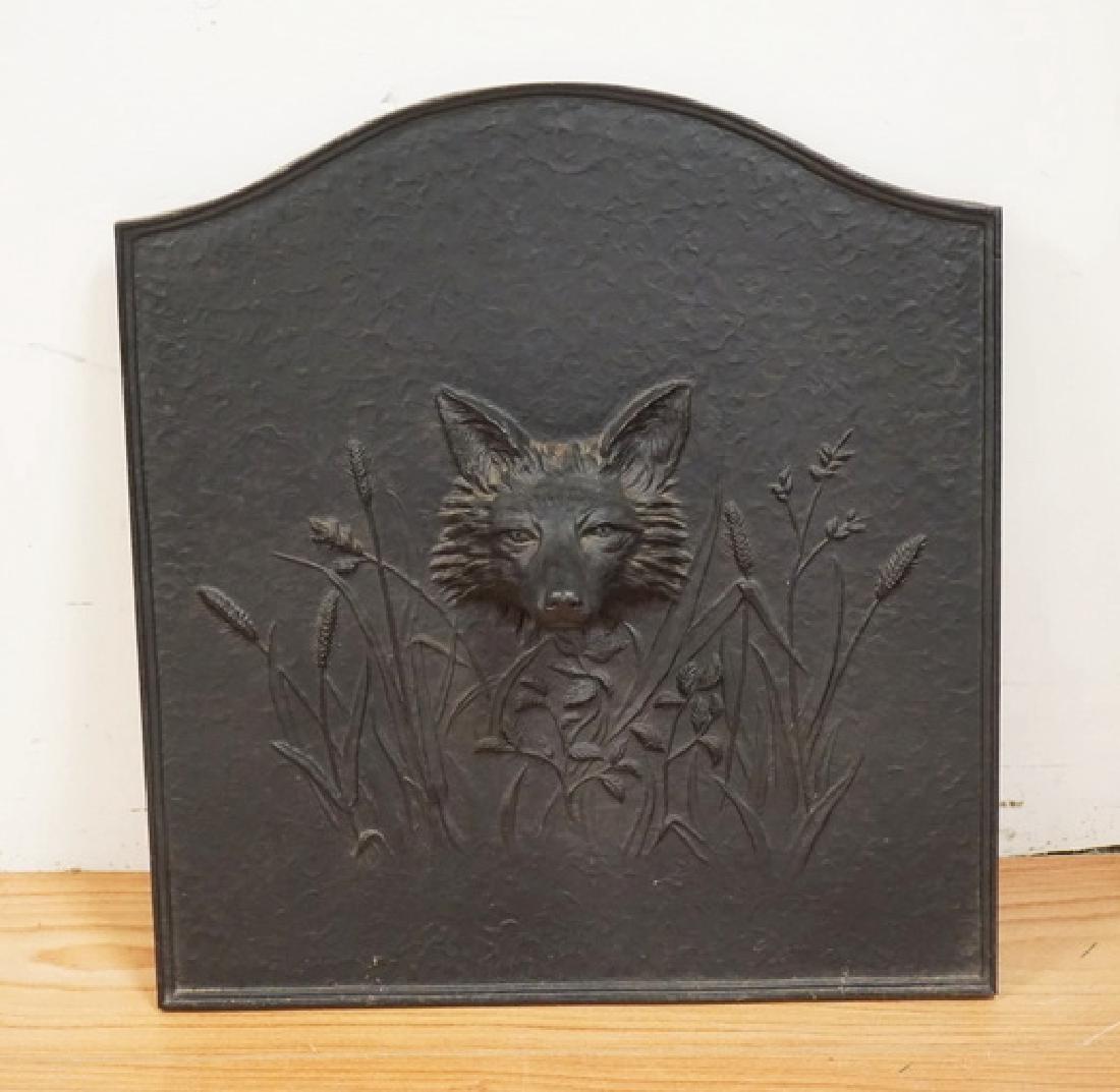 CAST IRON FIREBACK WITH A DEEP RELIEF FACE OF A FOX. 21