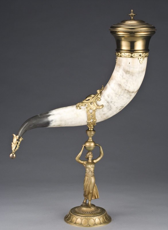 1: Gilt metal and horn cornucopia on stand, the stand h