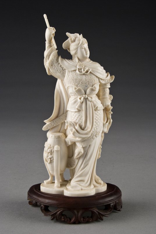 12: Chinese carved ivory lady warrior depicting the