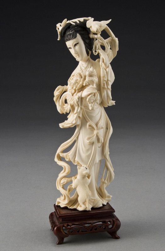 278: Chinese carved ivory lady holding flowers with a