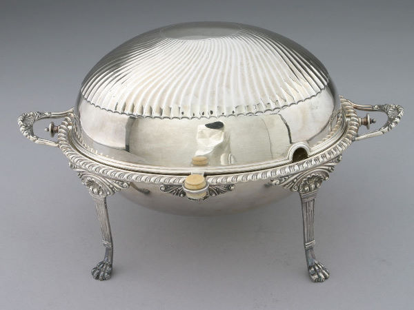 17: A silver plated revolving breakfast server the top