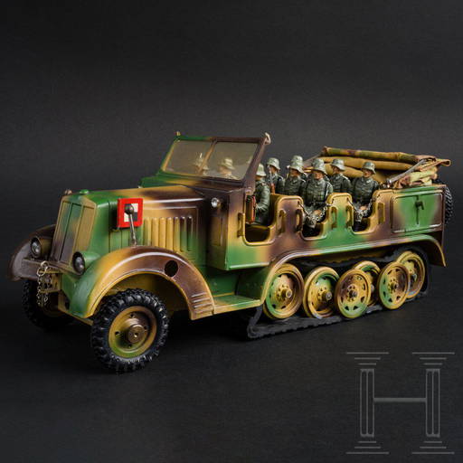 A Lineol half-track vehicle 1221/5 (all-terrain vehicle) in camouflage finish with 11 WH ...