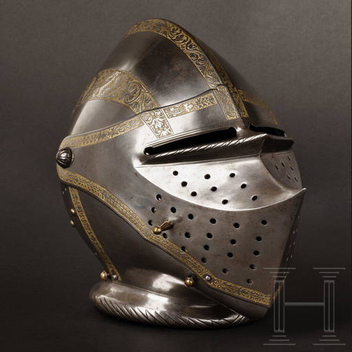 A significant South German close helmet with etched and gilt decor ...