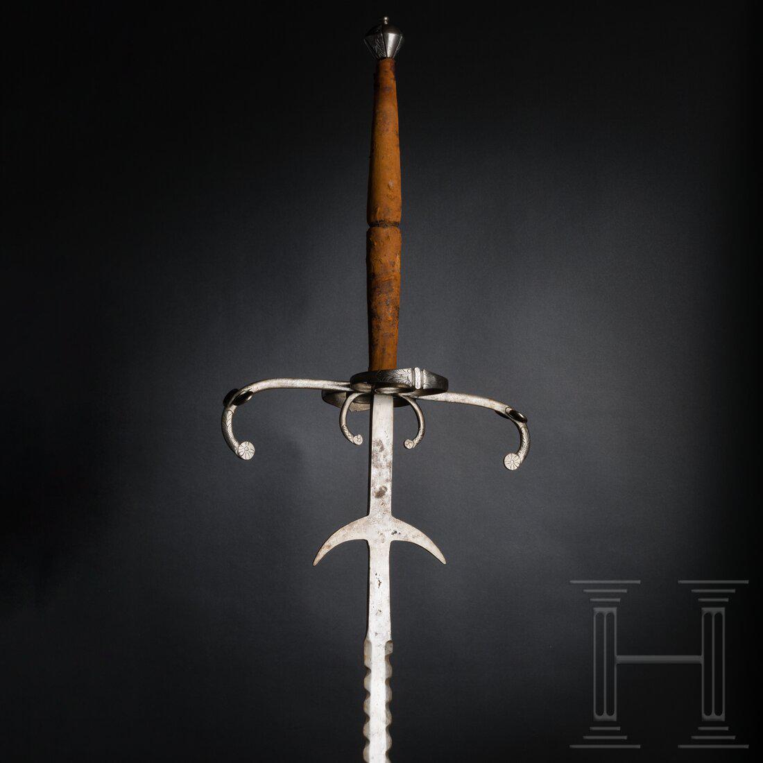 A South German two-hand flamberge with finely decorated hilt, circa ...