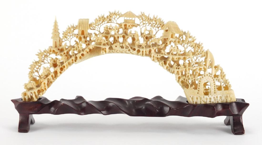 Chinese ivory tusk bridge, finely carved with village