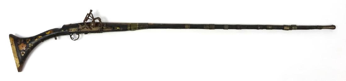 Antique camel hunting flintlock musket with bone inlay,