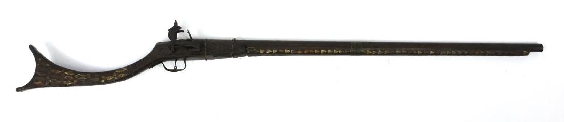 Antique camel hunting flintlock musket with bone inlay,