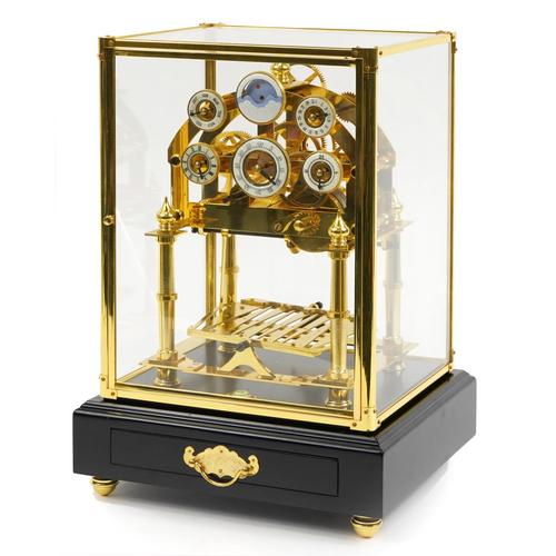 Congreve style rolling ball clock housed under a glazed brass display ...