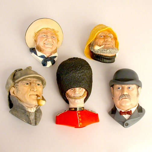 1197: 5 BOSSONS WALL MASKS. N/R. 5 compositio