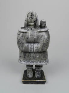 An Inuit Stone Sculpture Of Mother And Child