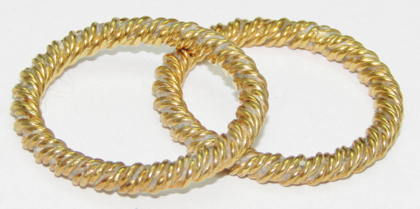 Pair Of 18kt Gold Twist Wire Bands Auction