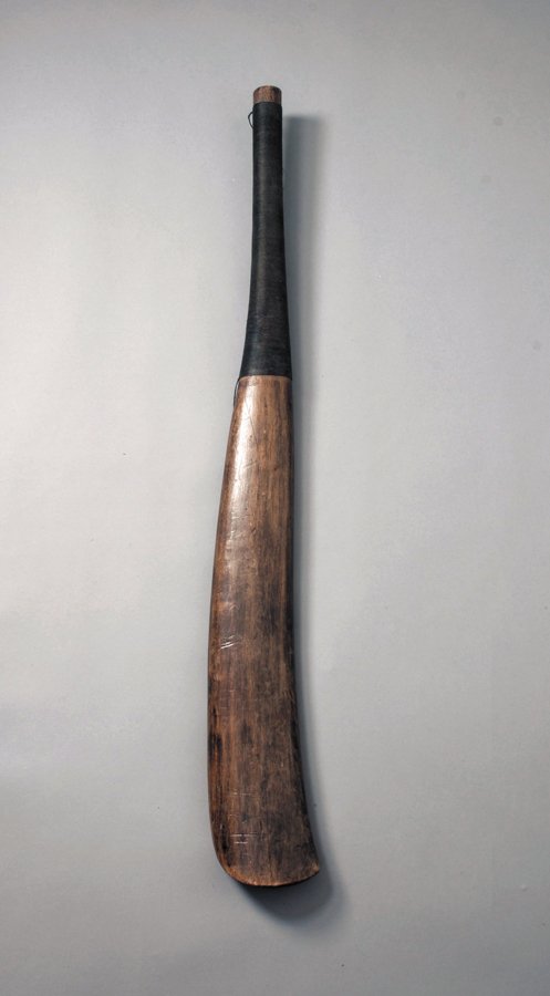 194: A curved blade cricket bat, shoulderless, with lon