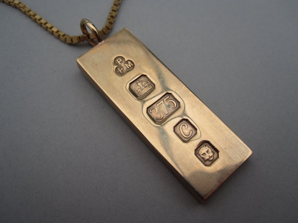 A Jubilee 9ct gold ingot pendant and chain, - Jun 19, 2013 | Cheffins ...