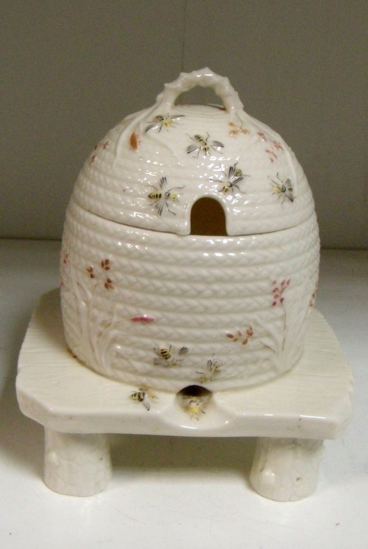 A 'First Period' Belleek honey pot and cover,