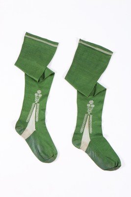 A pair of frame-knitted green silk stockings, English