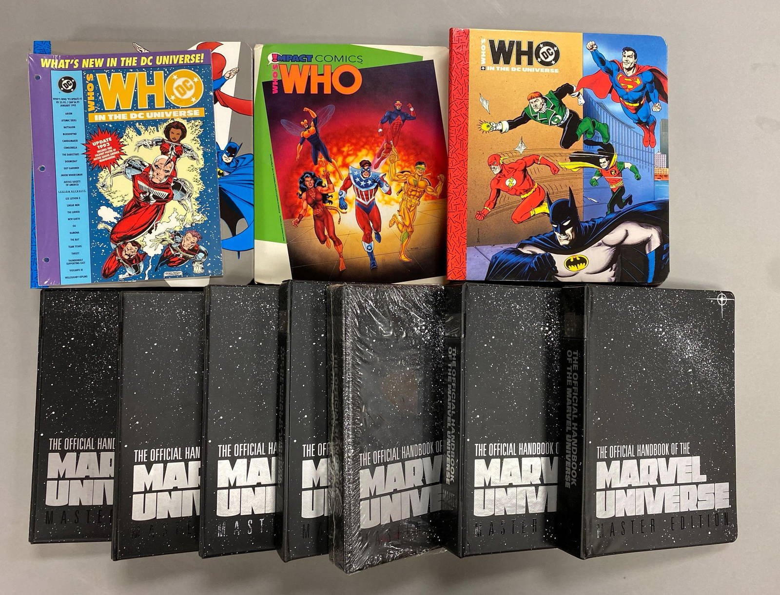 Group Of Assorted Marvel And Dc Ephemera And Binders Auction
