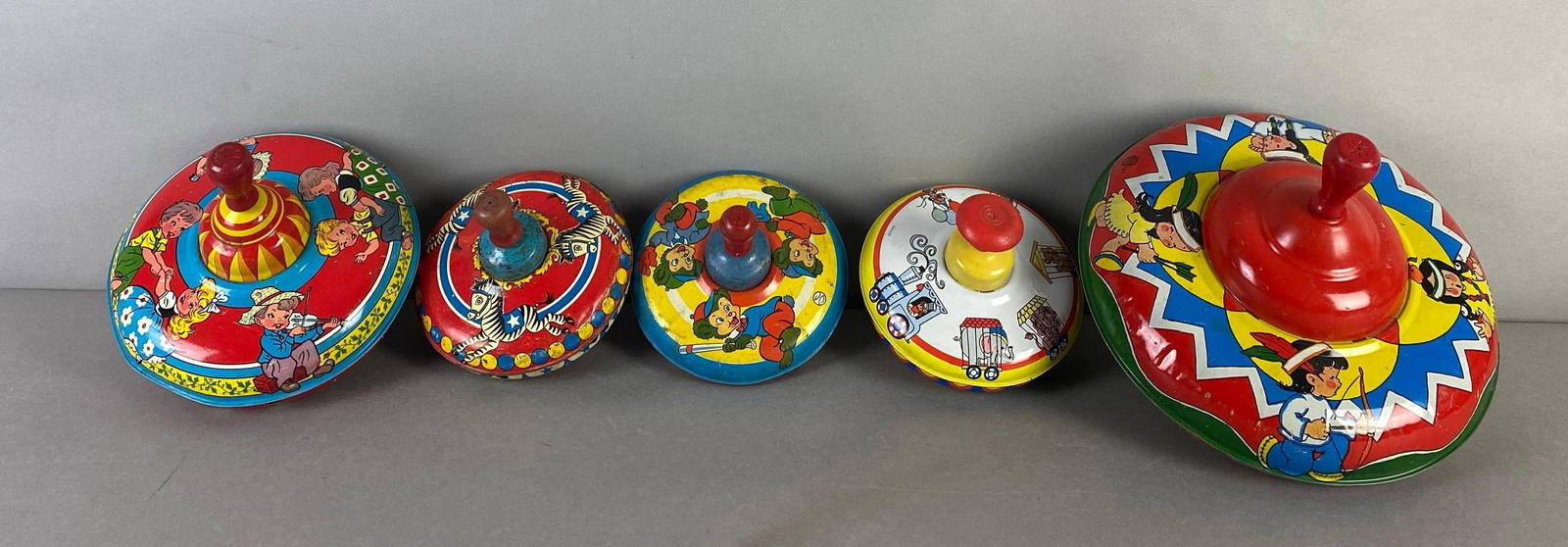 Group Of 5 Tin-litho Tops Auction
